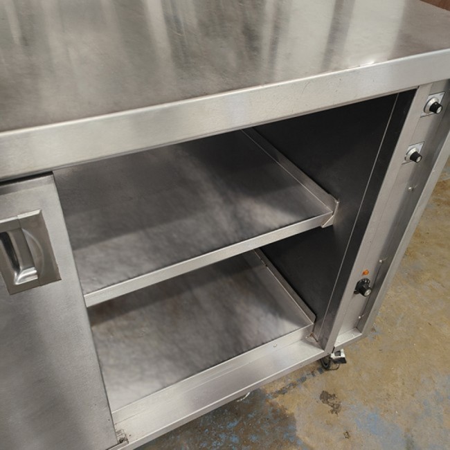 Pass though table with heated lamps