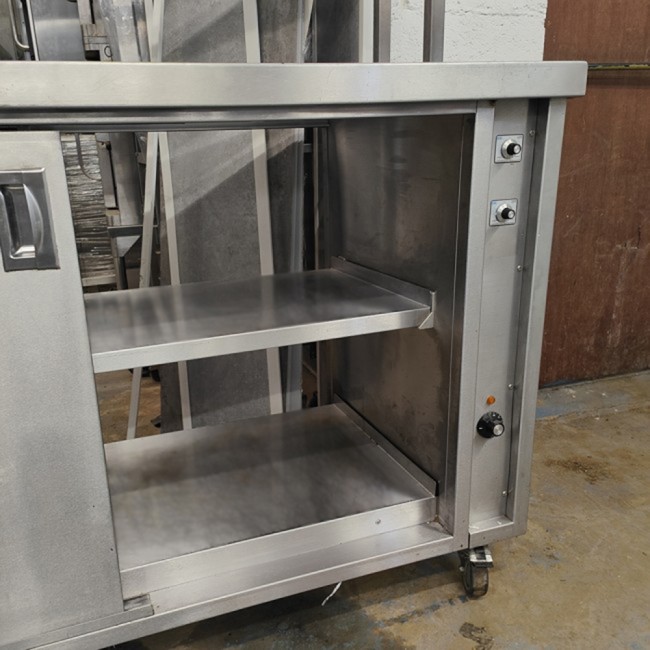 Pass though table with heated lamps